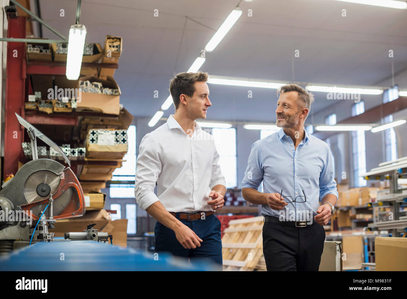 Two people walking in an industry hi-res stock photography and images ...