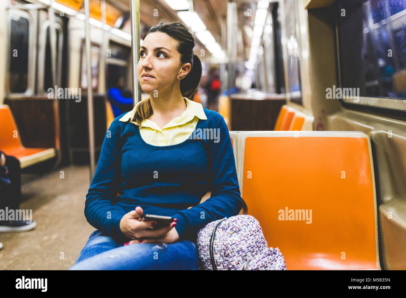 Woman on new york city subway hi-res stock photography and images - Alamy