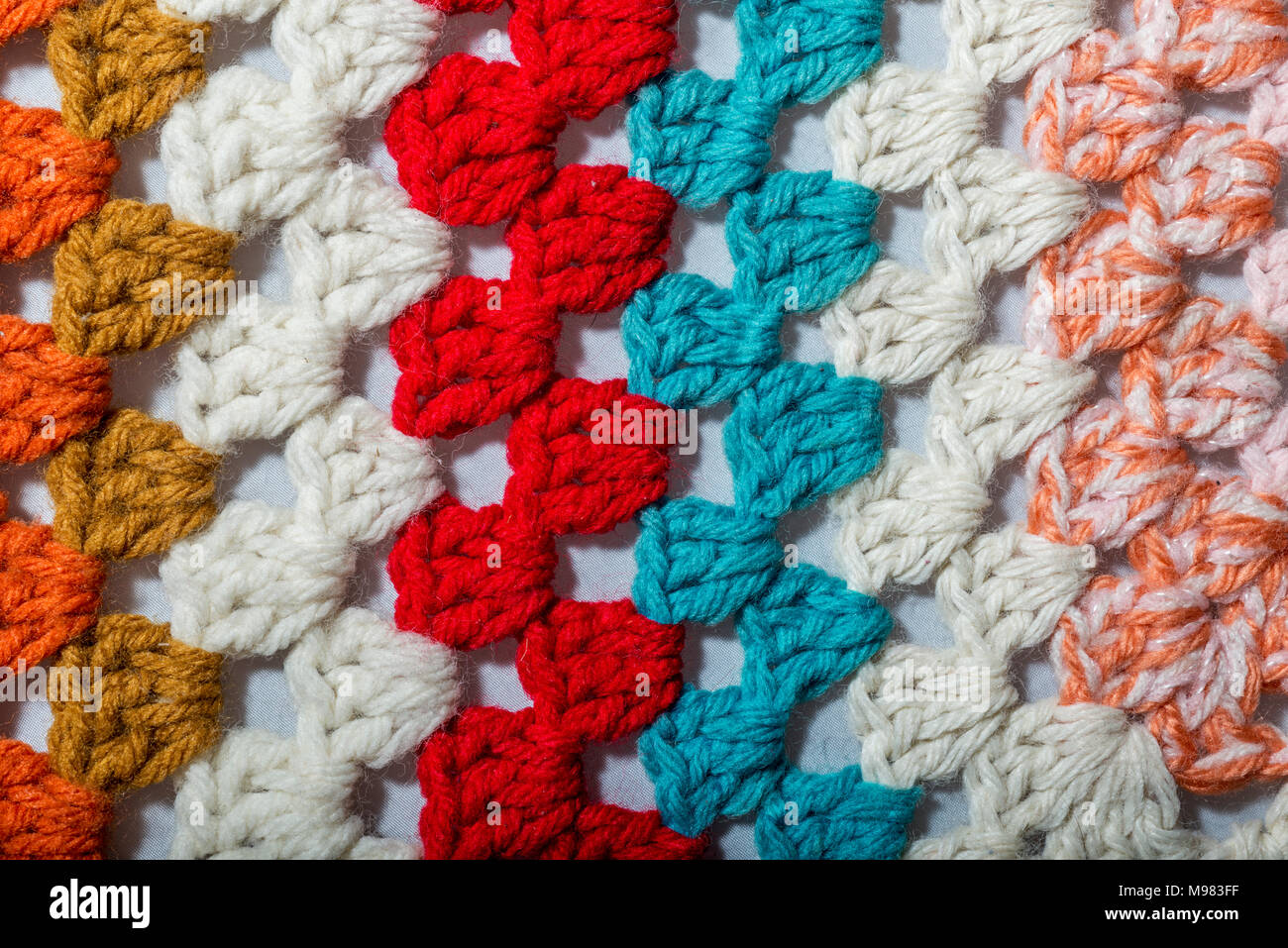 a handmade crochet fabric of different colors Stock Photo - Alamy