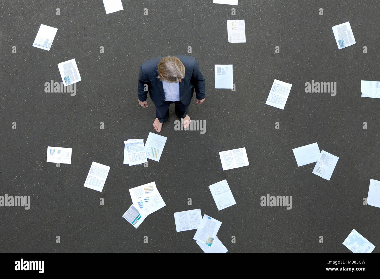 Man surrounded by paperwork hi-res stock photography and images - Alamy