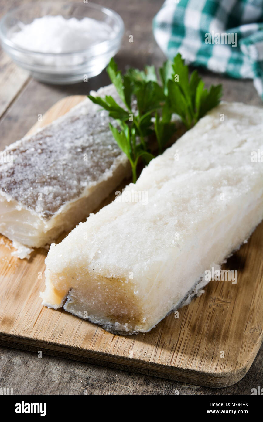 Salted dried cod on wooden table. Typical Easter food Stock Photo - Alamy
