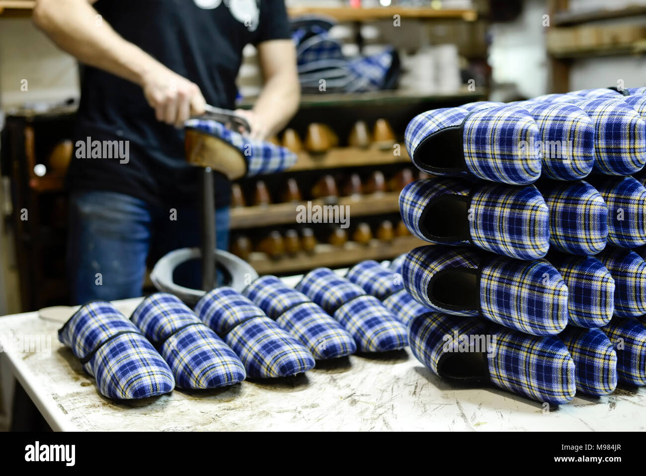 Close-up of shoemaker working on slippers in workshop Stock Photo - Alamy