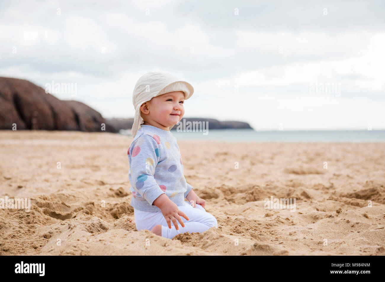Crouching beach hi-res stock photography and images - Alamy