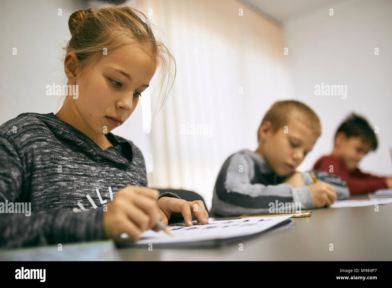 Students learning in class Stock Photo - Alamy