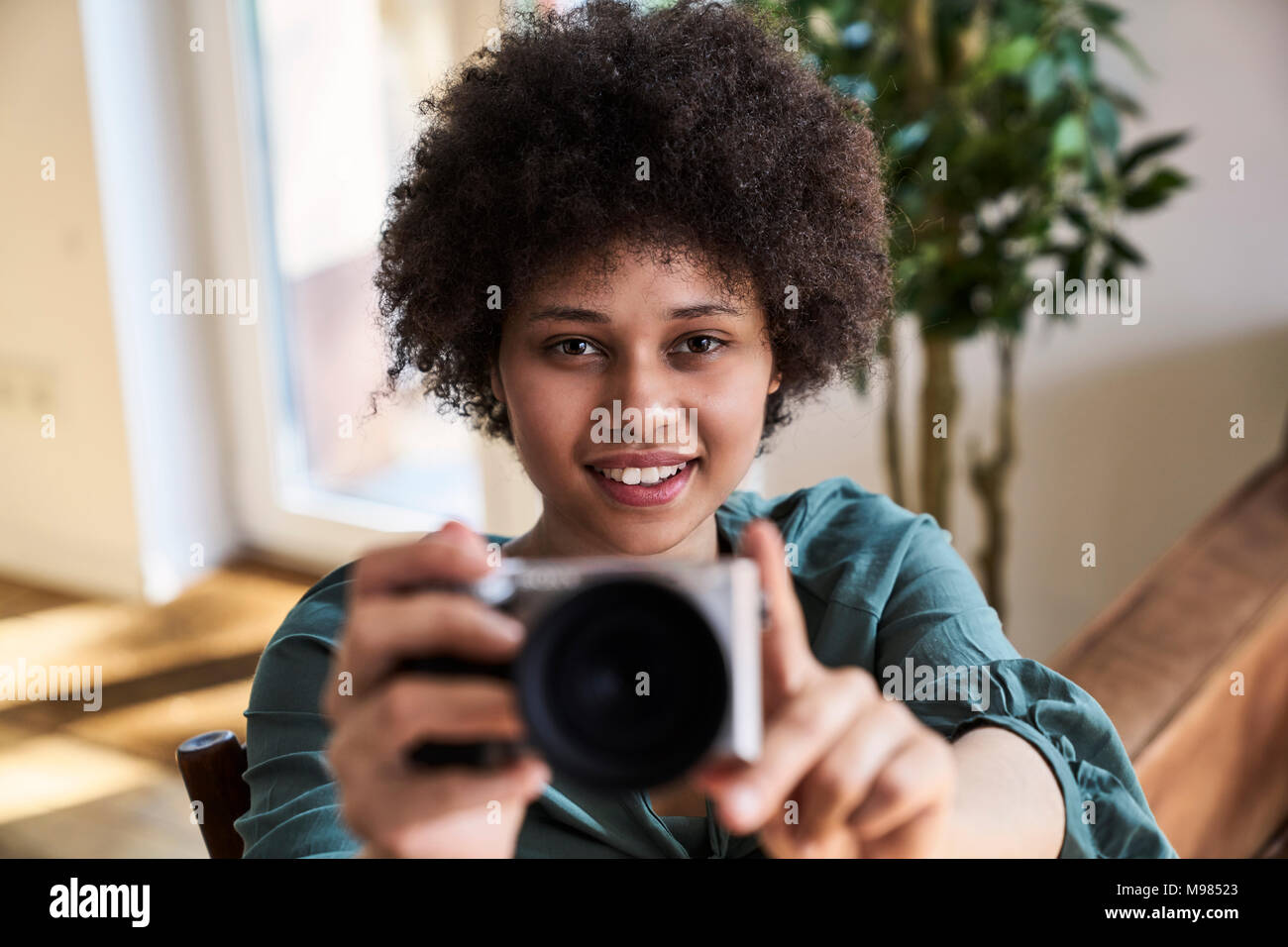 Young photographer woman holding camera hi-res stock photography and ...