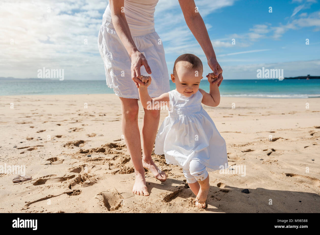 Child helping mother hi-res stock photography and images - Alamy