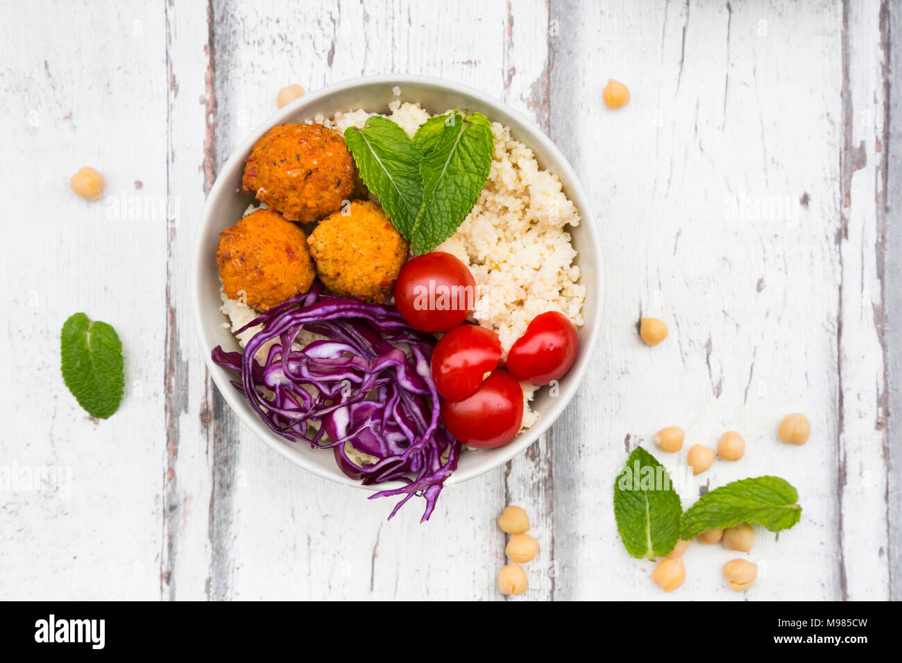 Buddha bowl of sweet potato balls, Couscous, Hummus and vegetables ...