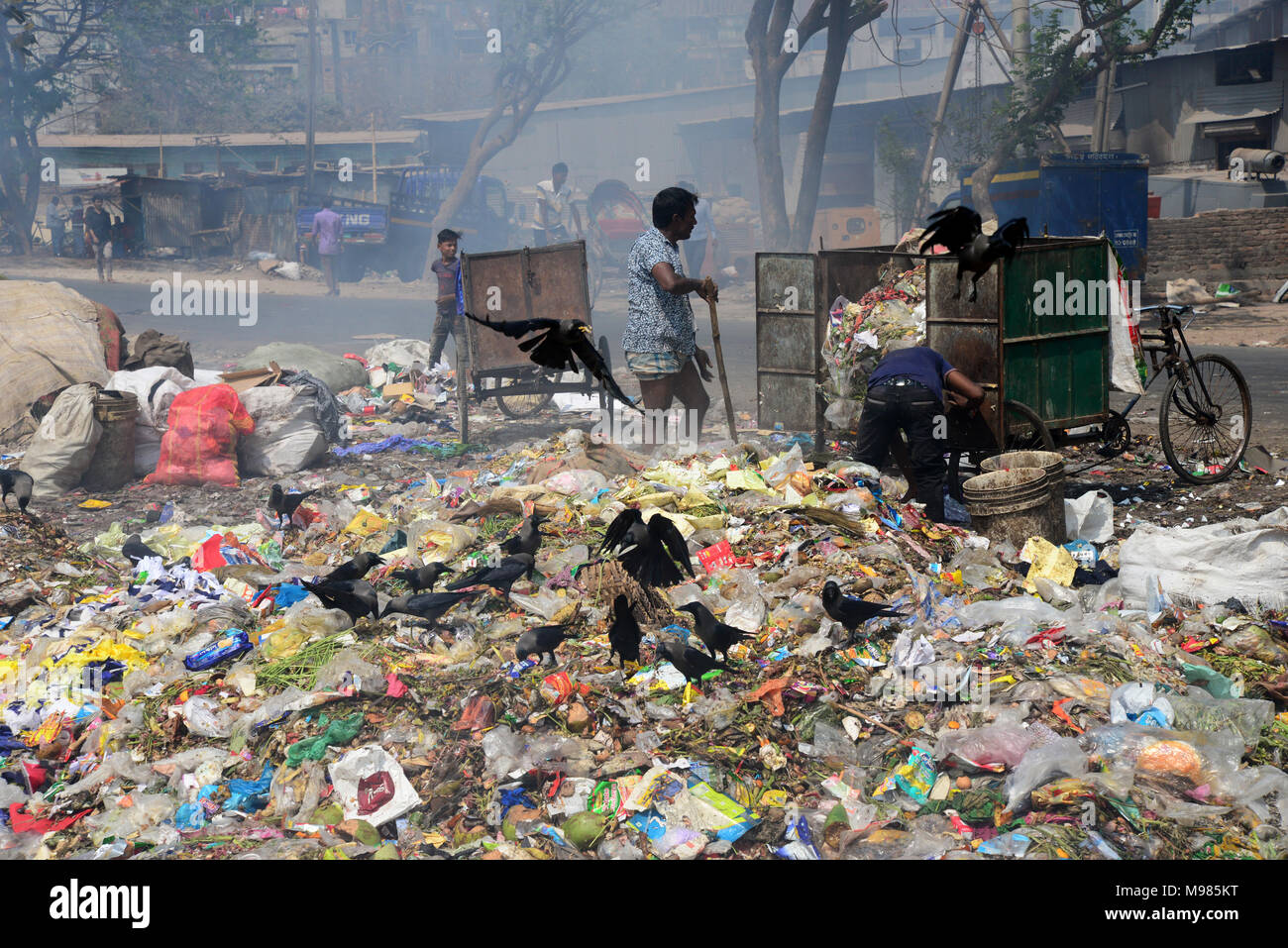 Bangladeshi people waste picker picks the non- biodegradable waste to ...