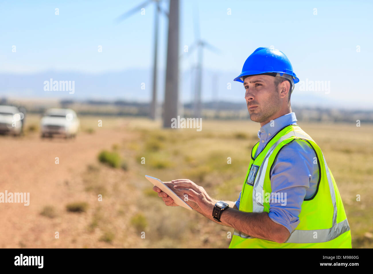 Engineer helmet on blue hi-res stock photography and images - Alamy