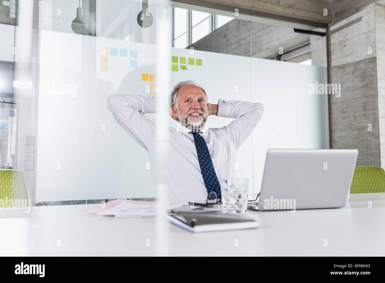 Man desk leaning back hands hi-res stock photography and images - Alamy