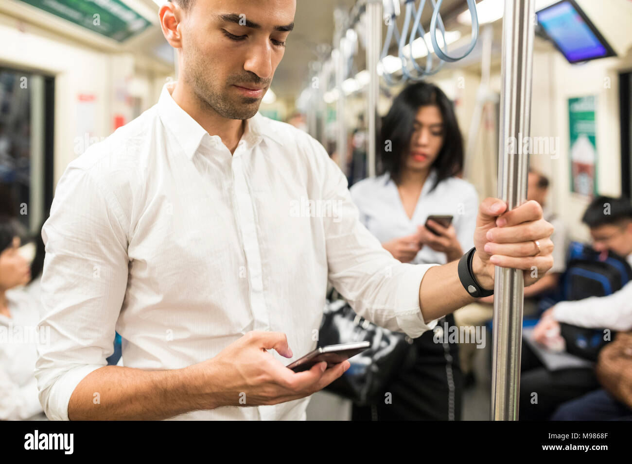 Cell phones people subway hi-res stock photography and images - Alamy