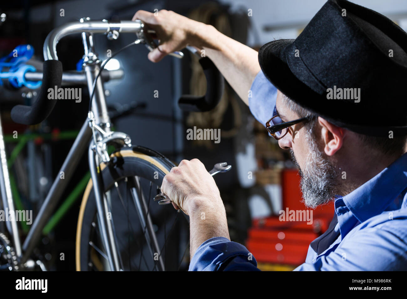 Man with his bicycle hi-res stock photography and images - Alamy
