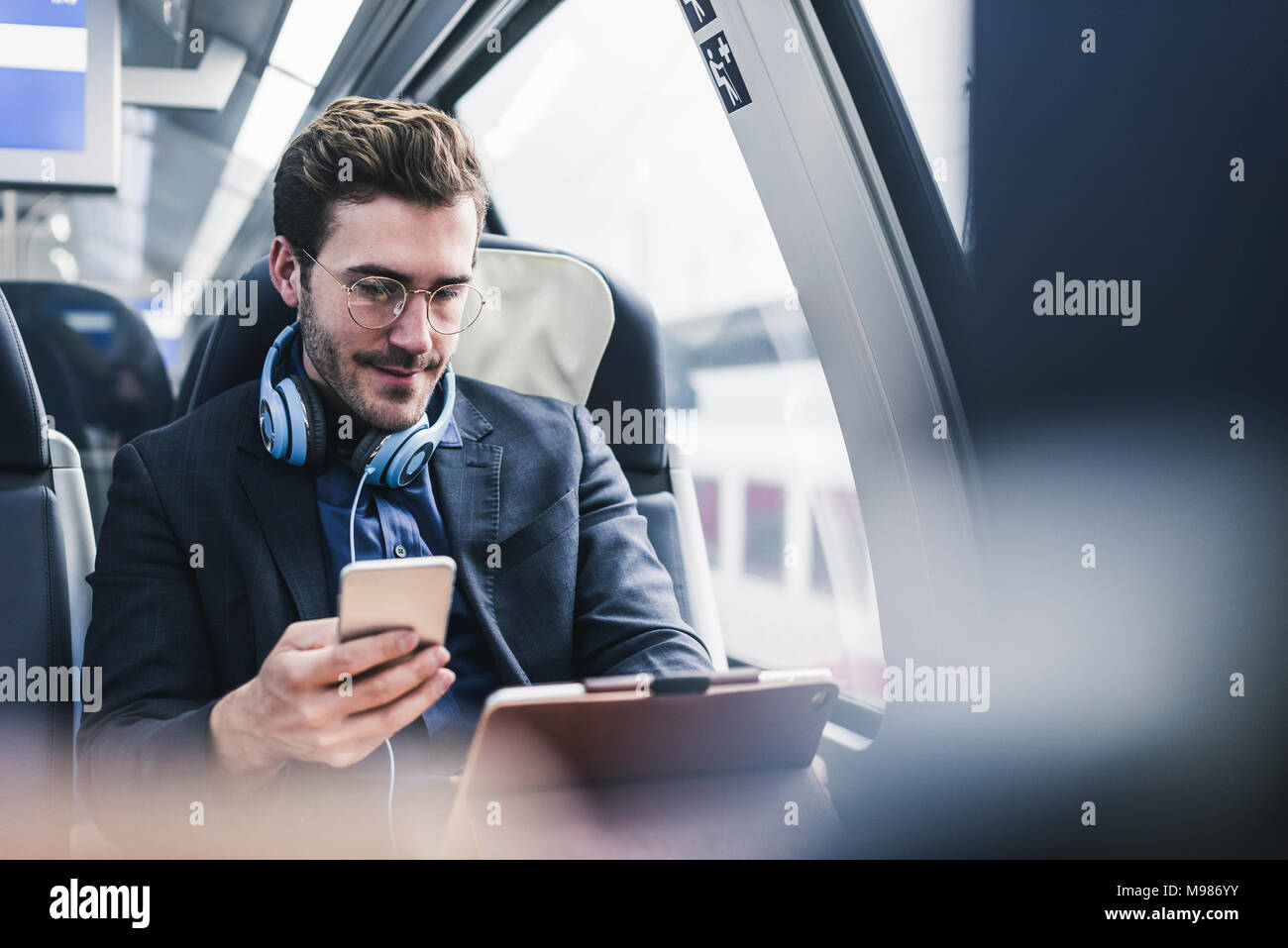 Phone on train and headphones hi-res stock photography and images - Alamy