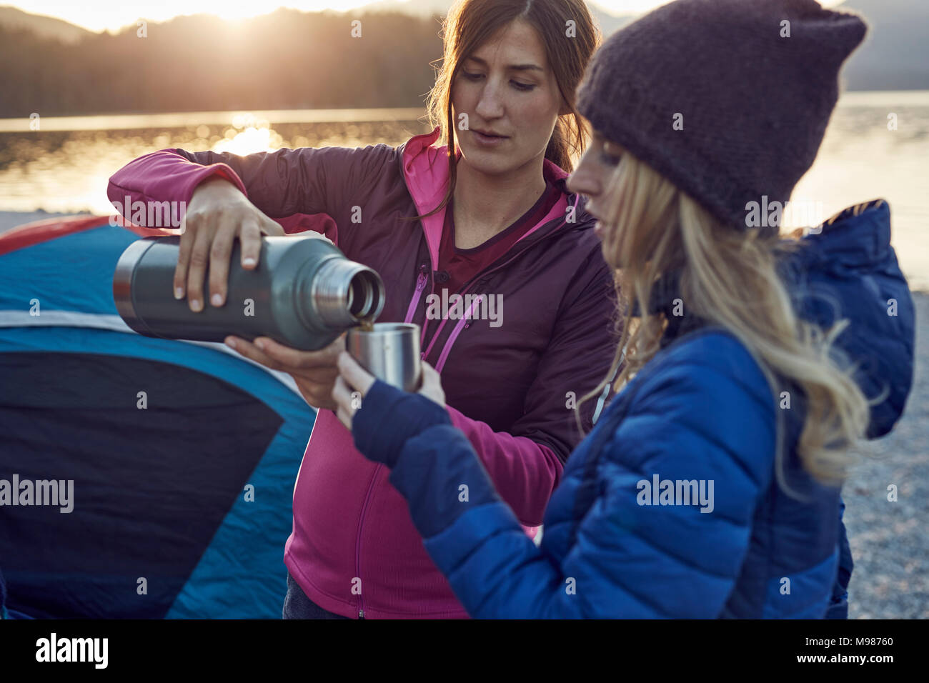 Two women camping at lake hi-res stock photography and images - Alamy
