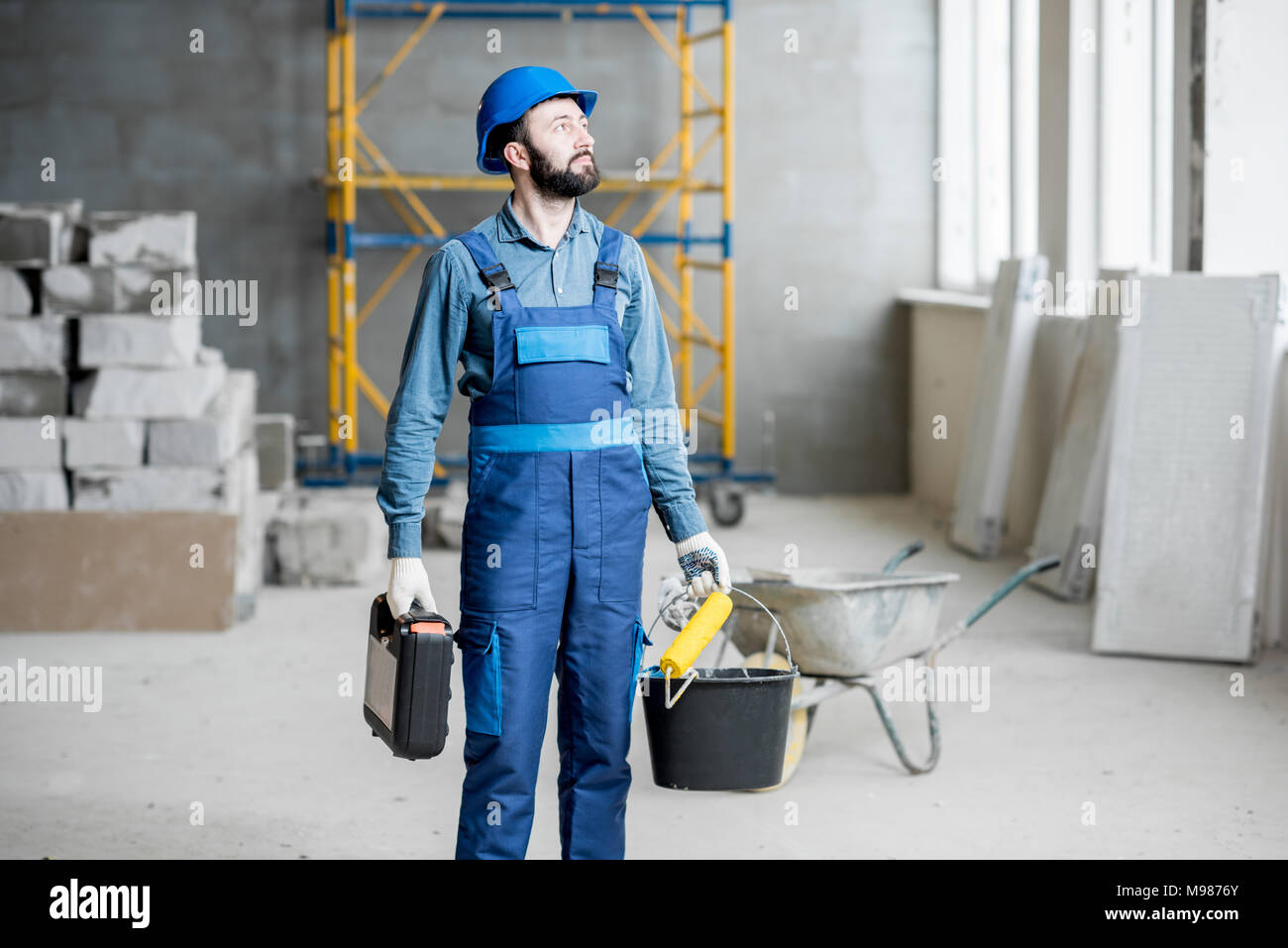 Builder at the construction site Stock Photo - Alamy