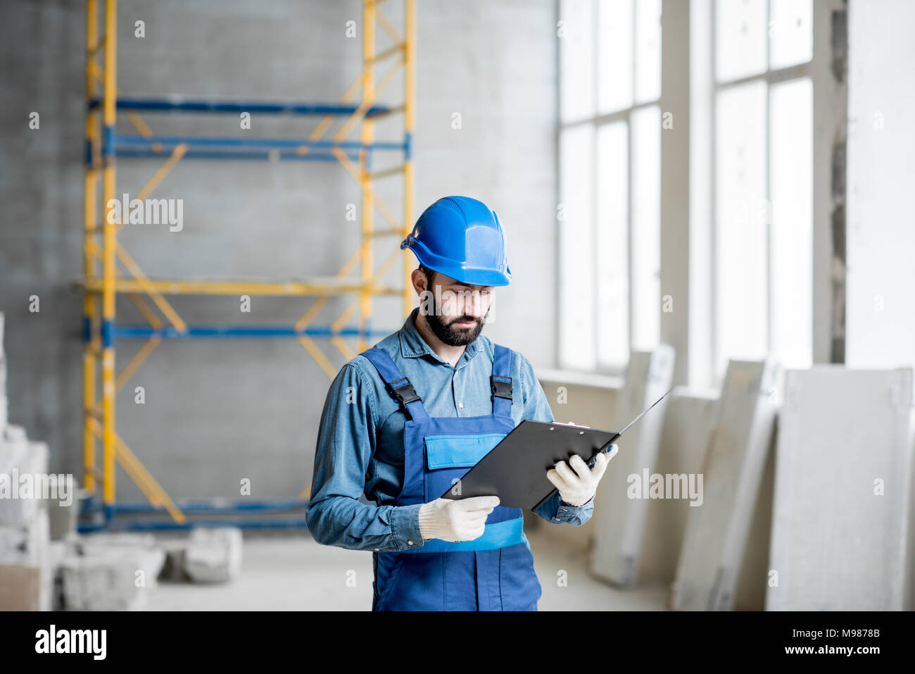 Builder at the construction site Stock Photo - Alamy