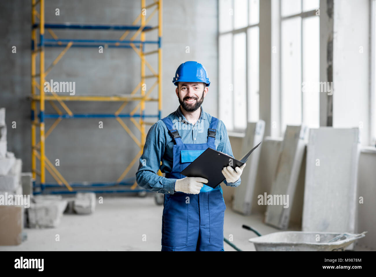 Builder at the construction site Stock Photo - Alamy