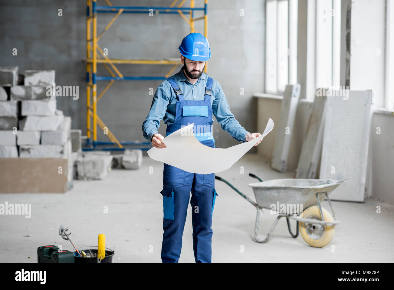 Builder at the construction site Stock Photo - Alamy