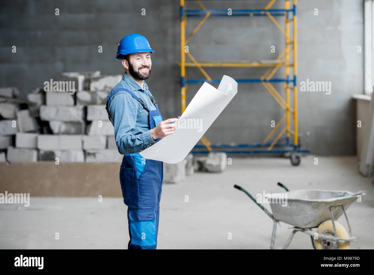 Builder at the construction site Stock Photo - Alamy