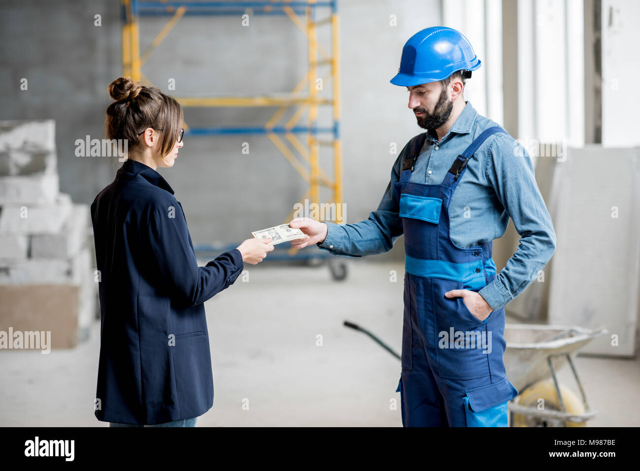 Woman giving a man money hi-res stock photography and images - Alamy