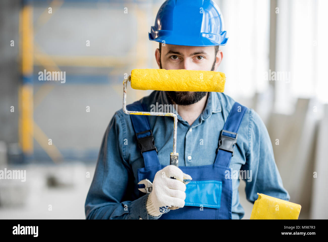 Man with paint roller hi-res stock photography and images - Alamy