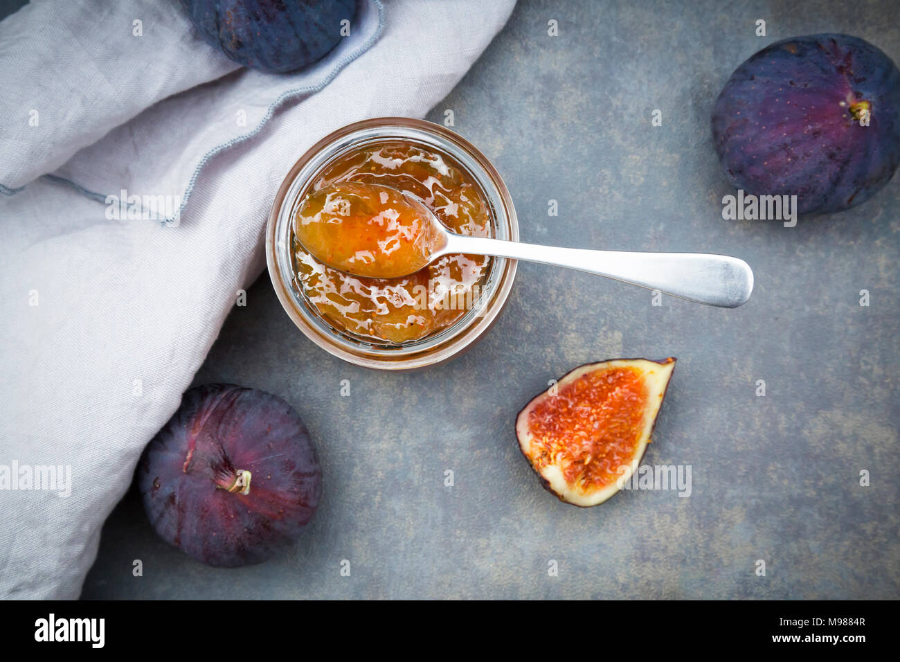 Organic figs and a glass of fig jam Stock Photo - Alamy
