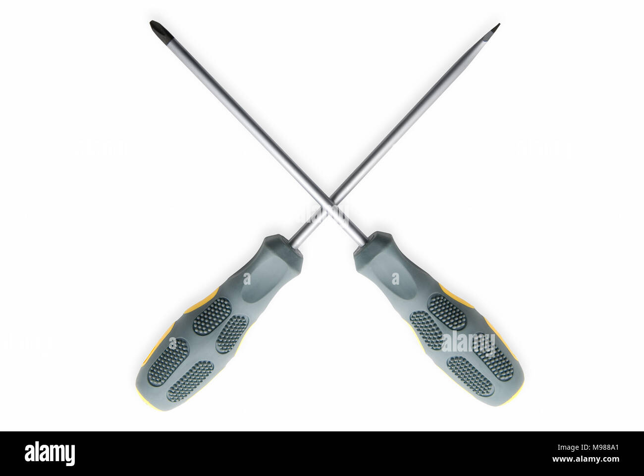 two crossed screwdrivers isolated on white background Stock Photo - Alamy