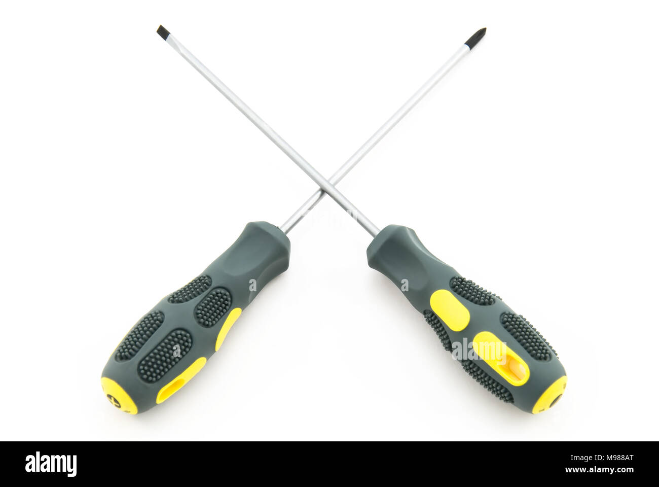 two crossed screwdrivers isolated on white background Stock Photo - Alamy