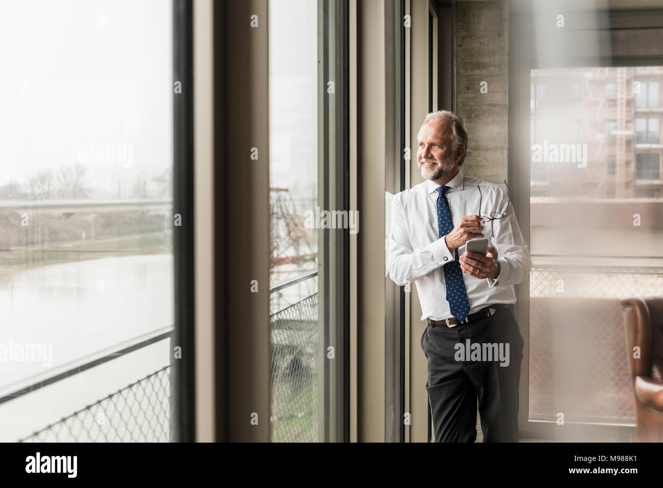Smiling standing looking away communication hi-res stock photography ...