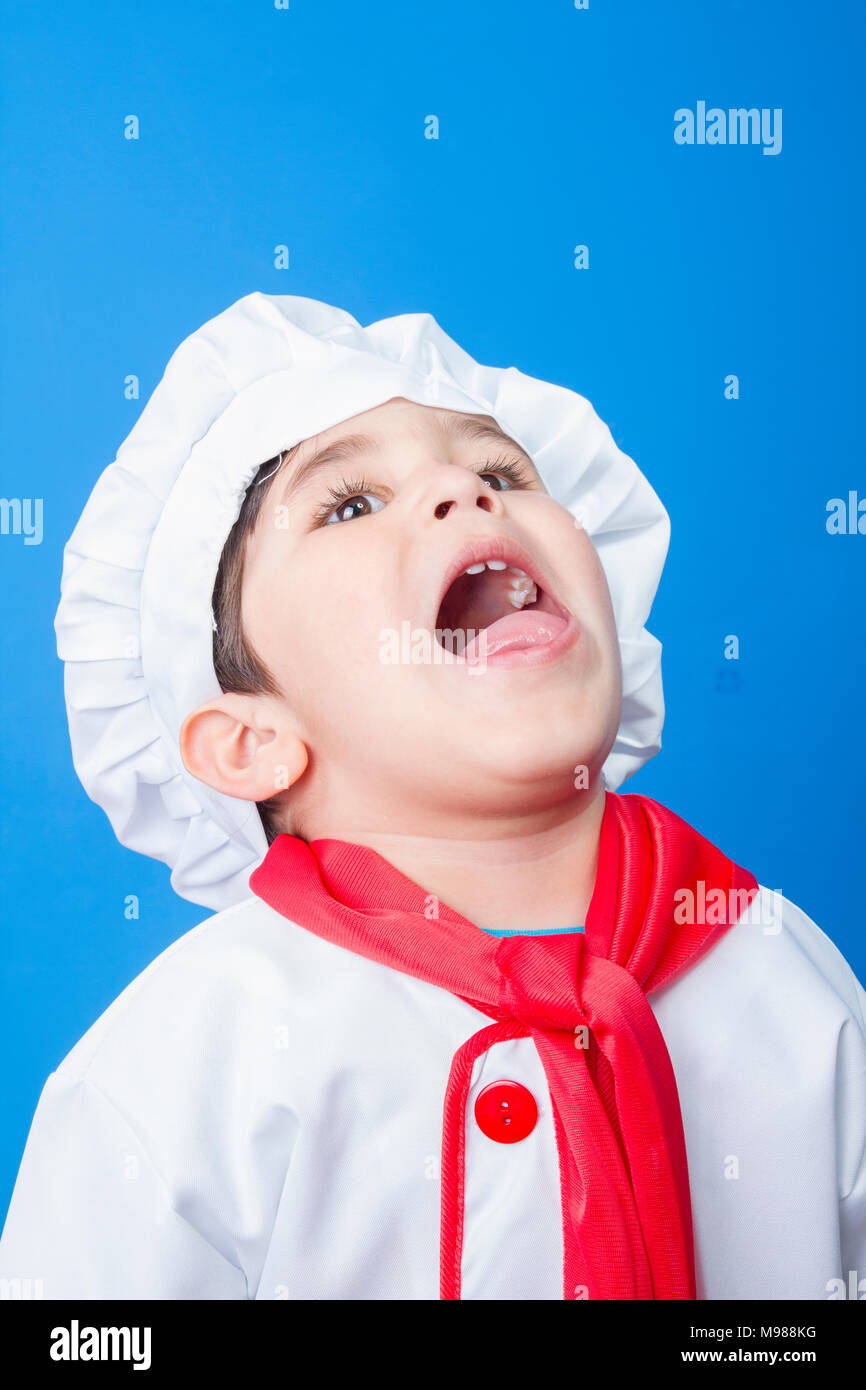 Cooking, The little boy in a suit of the cook. adorable little boy in ...