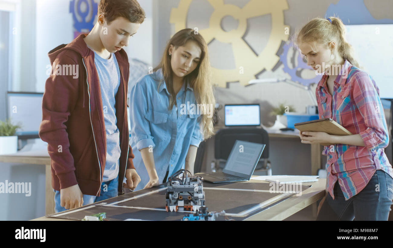 Two Girls and a Boy Program Self Driving Robot for School Science Class ...