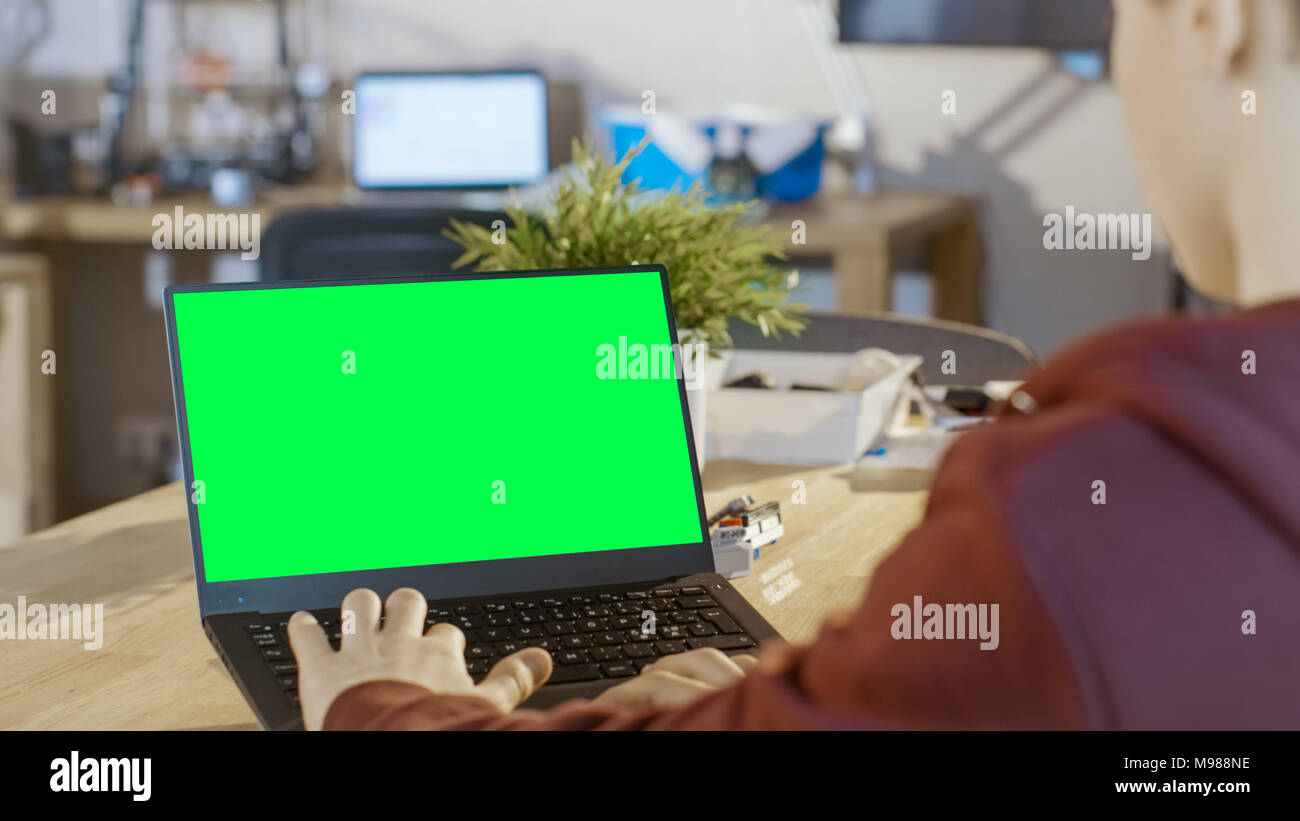 Smart Boy Uses Laptop with Mock-up Green Screen in His Computer Science ...