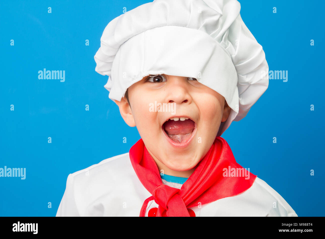 Cooking, The little boy in a suit of the cook. adorable little boy in ...