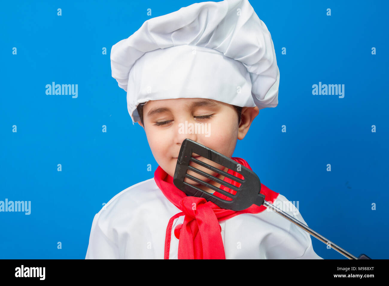 The little boy in a suit of the cook. adorable little boy in chef hat ...