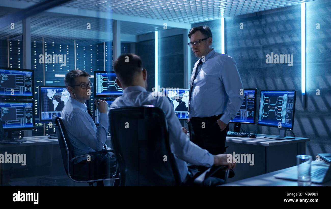 Team of Technical Moderators Have Discussion in Monitoring Room. System ...