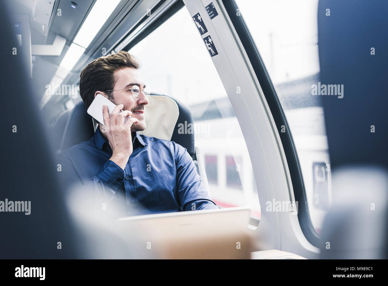 Man on laptop train hi-res stock photography and images - Alamy