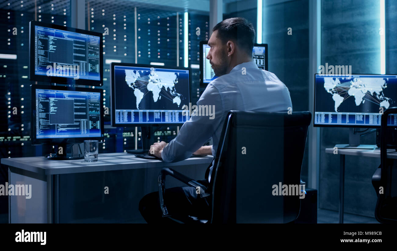 Technical Controller Working at His Workstation with Multiple Displays ...