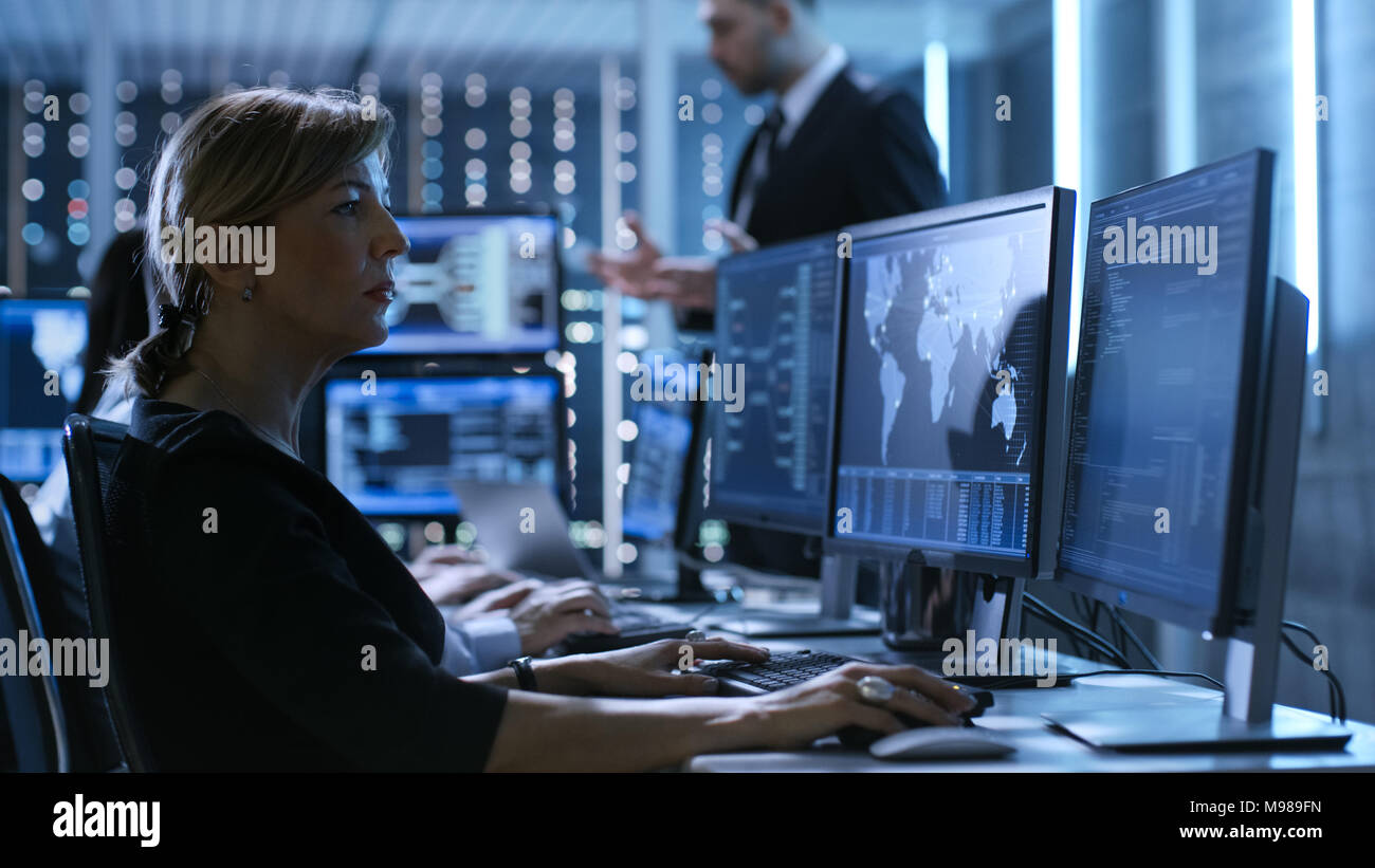 Female Government Employee Works in a Monitoring Room. In The ...