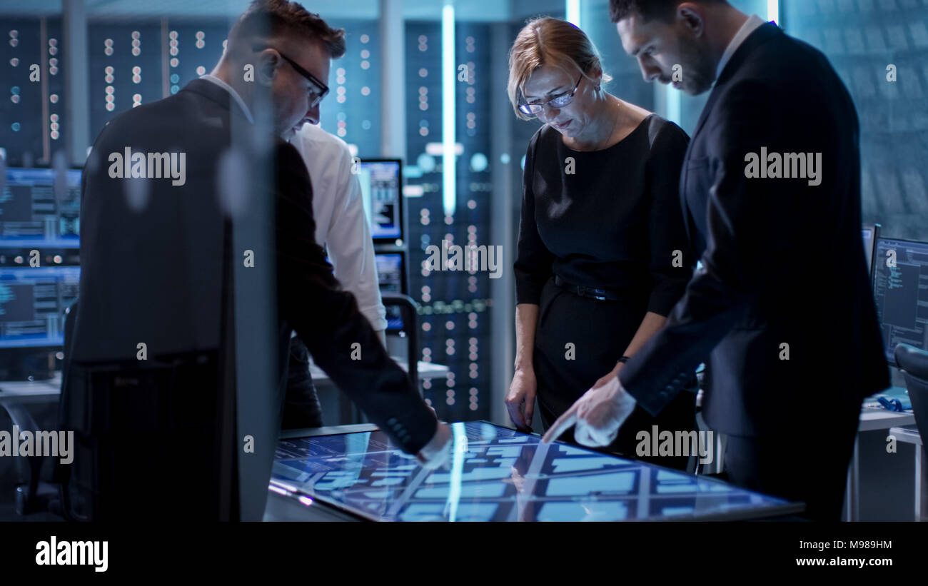 Government Agents Working at the Big Table in Monitoring Room. Room is ...