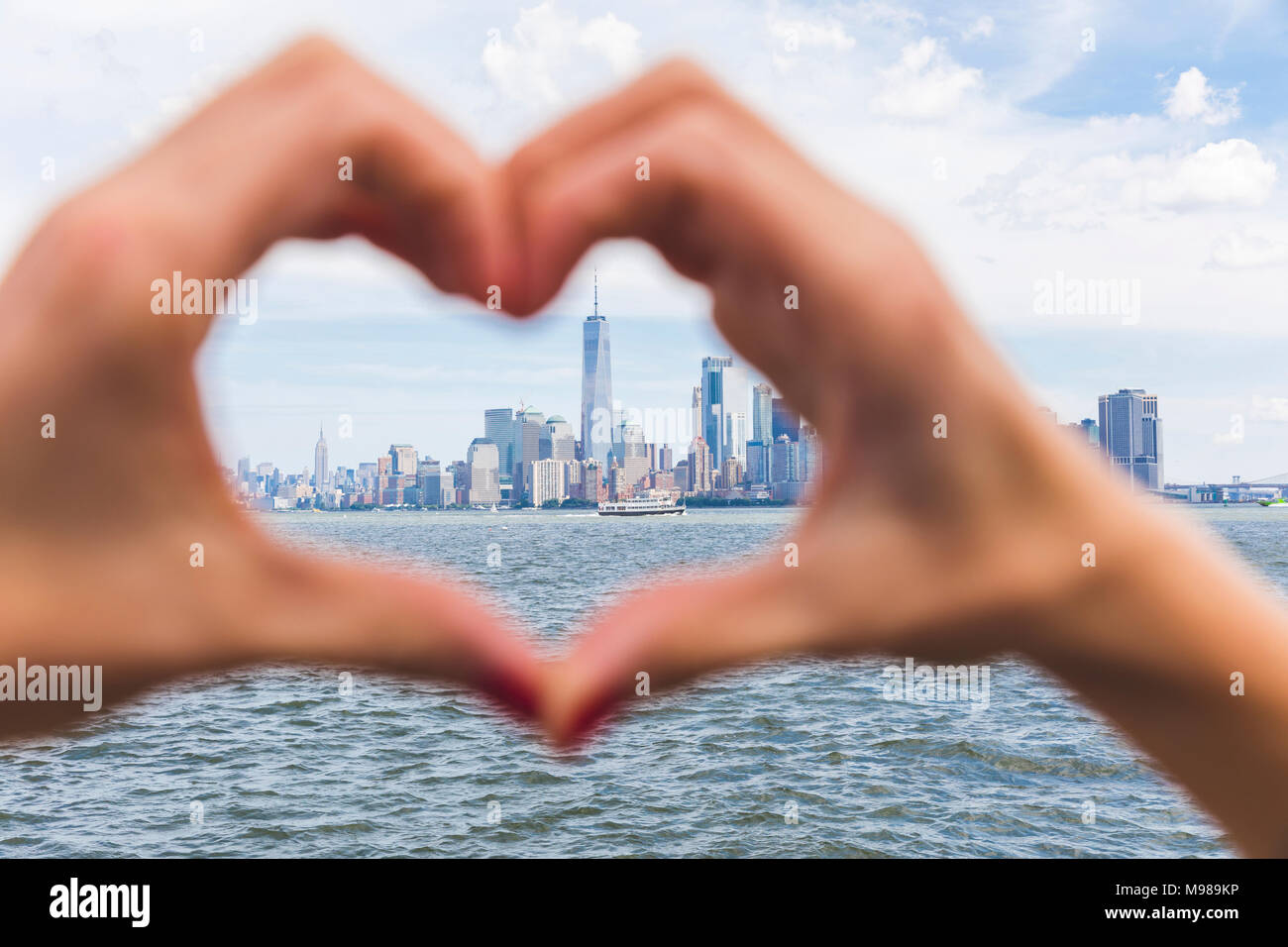 USA, New York, heart-shaped hands in front of Manhattan skyline Stock ...