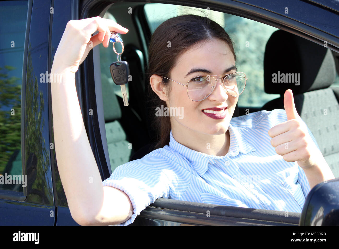 happy beautiful young driver Stock Photo - Alamy