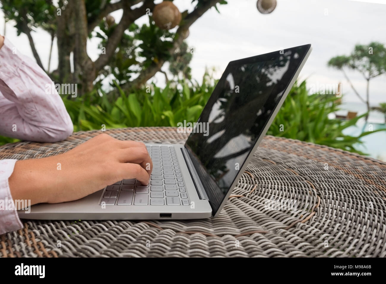 Recreational entrepreneur. Woman with laptop working during vacation in ...