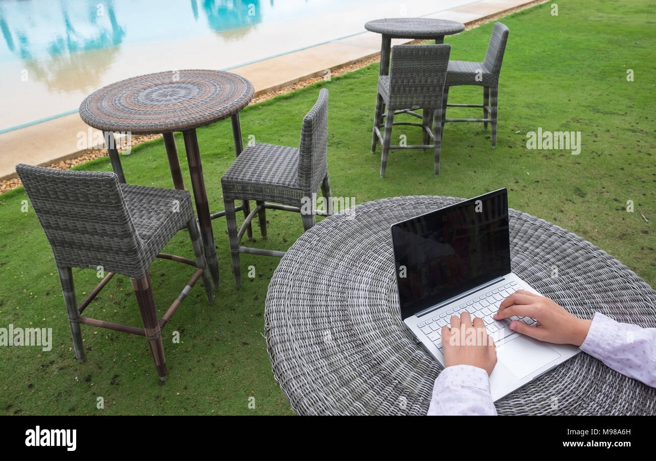 Recreational entrepreneur. Woman with laptop working during vacation in ...