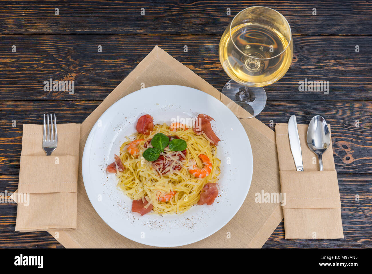 High angle view of appetizing spaghetti pasta with shrimps, grated ...