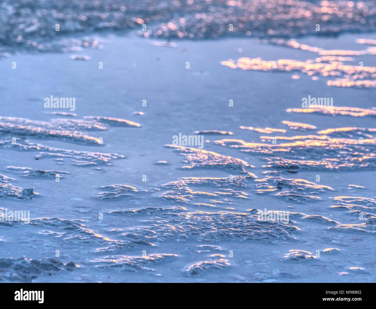 Natural winter icy background of defocused ice with copy space. Blue ...