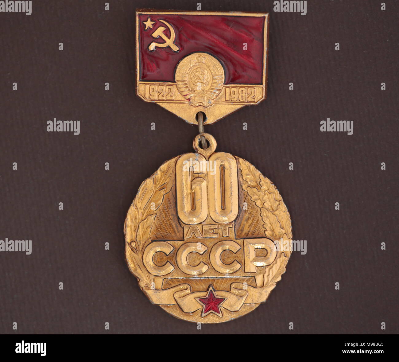 Soviet medal with the inscription 60 years of the USSR on a brown ...