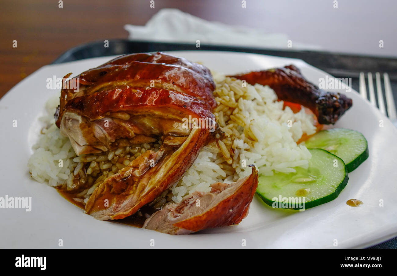Chinese chicken rice with sauce and vegetables in Singapore Stock Photo ...