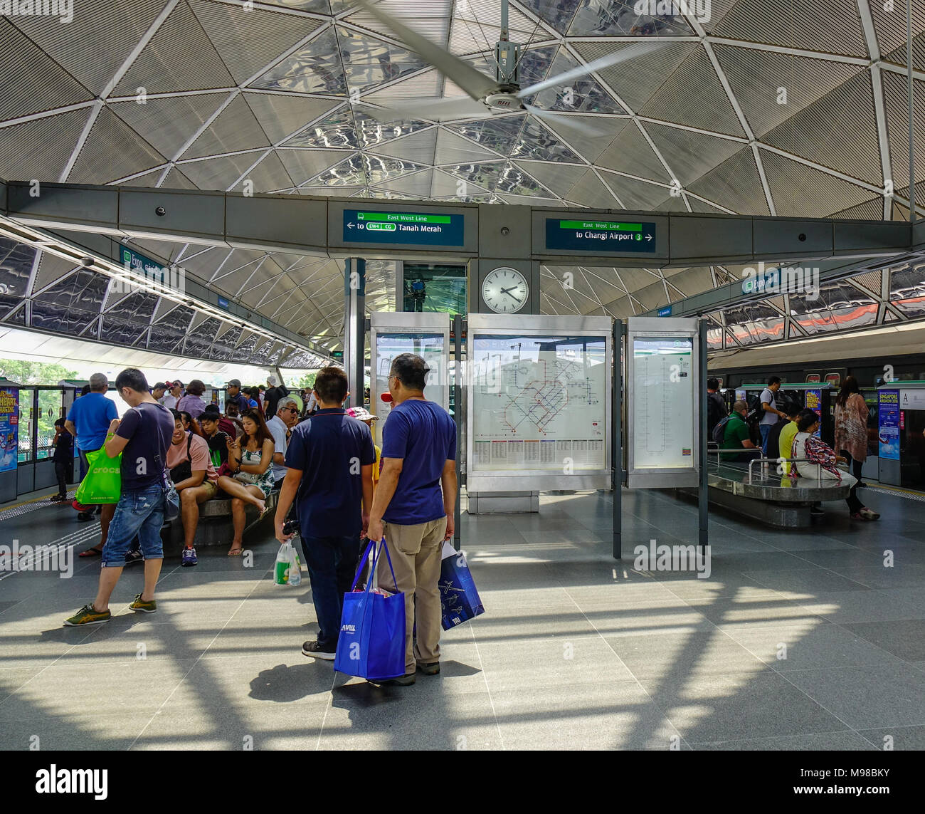 Singapore - Feb 11, 2018. People waiting at MRT station in Singapore ...