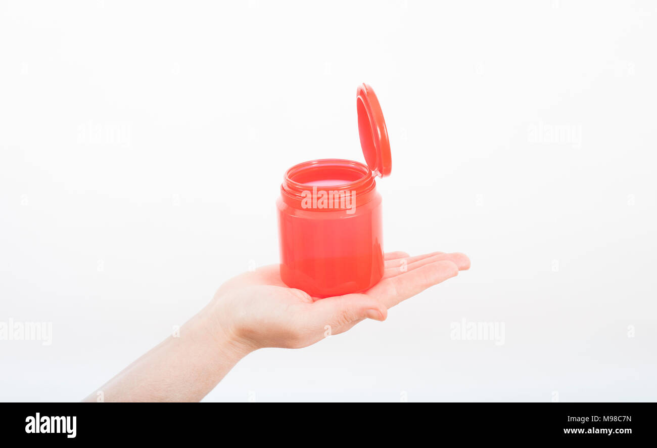 hand holding empty red can with open lid Stock Photo - Alamy