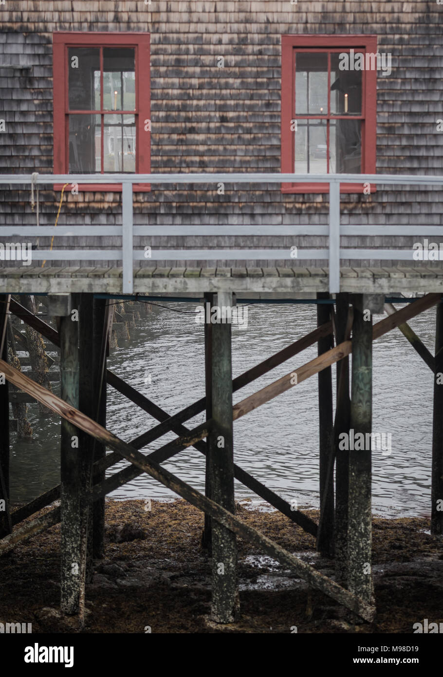 Shake Covered Shack on Stilts at low tide Stock Photo - Alamy